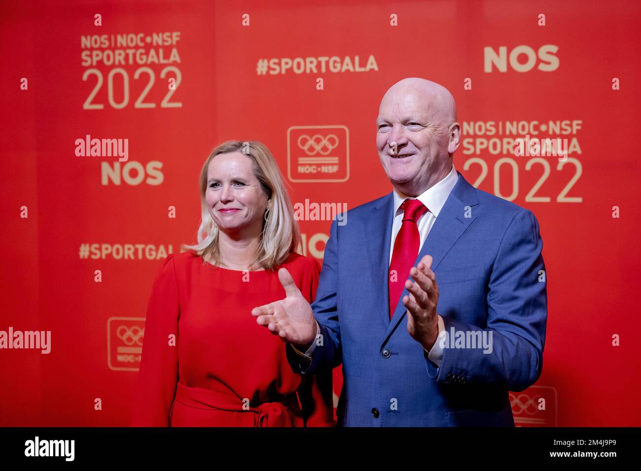 AMSTERDAM - 21/12/2022, Arnold Karskens with his partner on the red carpet prior to the NOC*NSF ...