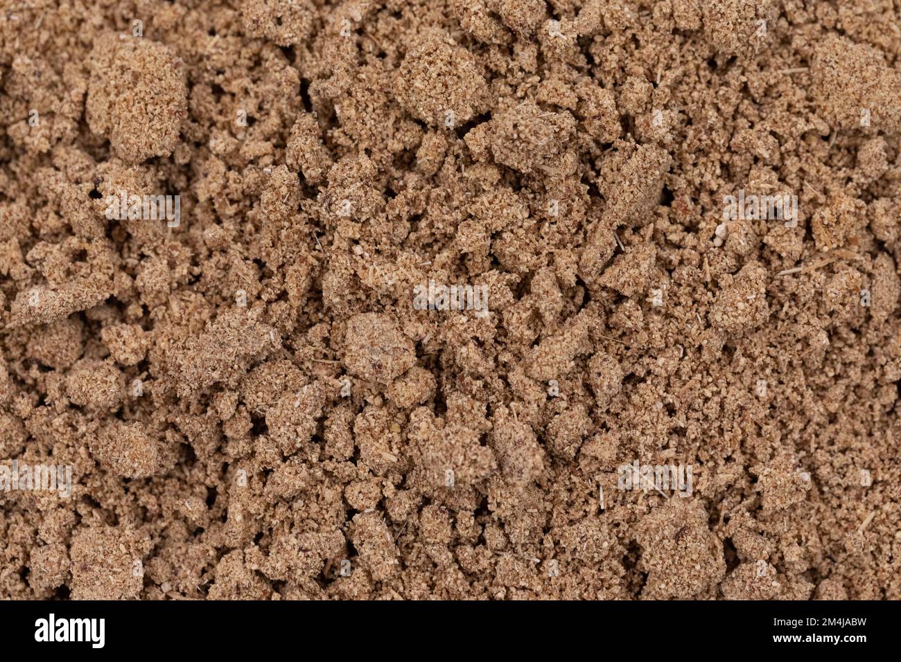 Close-up of a rectangle of fertilized soil with organic compost ...