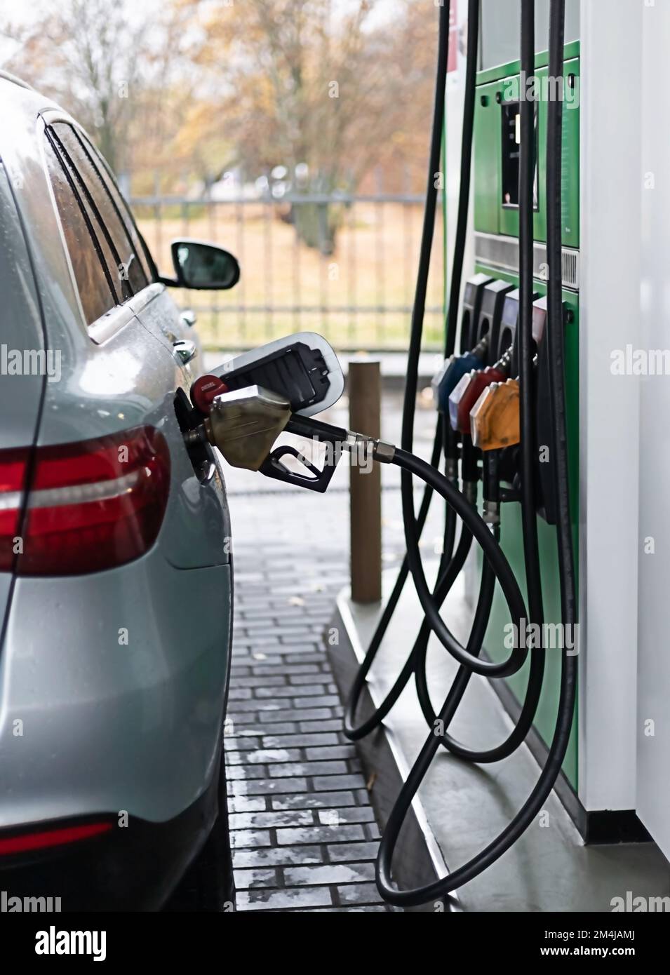 Refueling diesel and petrol fuel, car at gas station. The fuel crisis ...