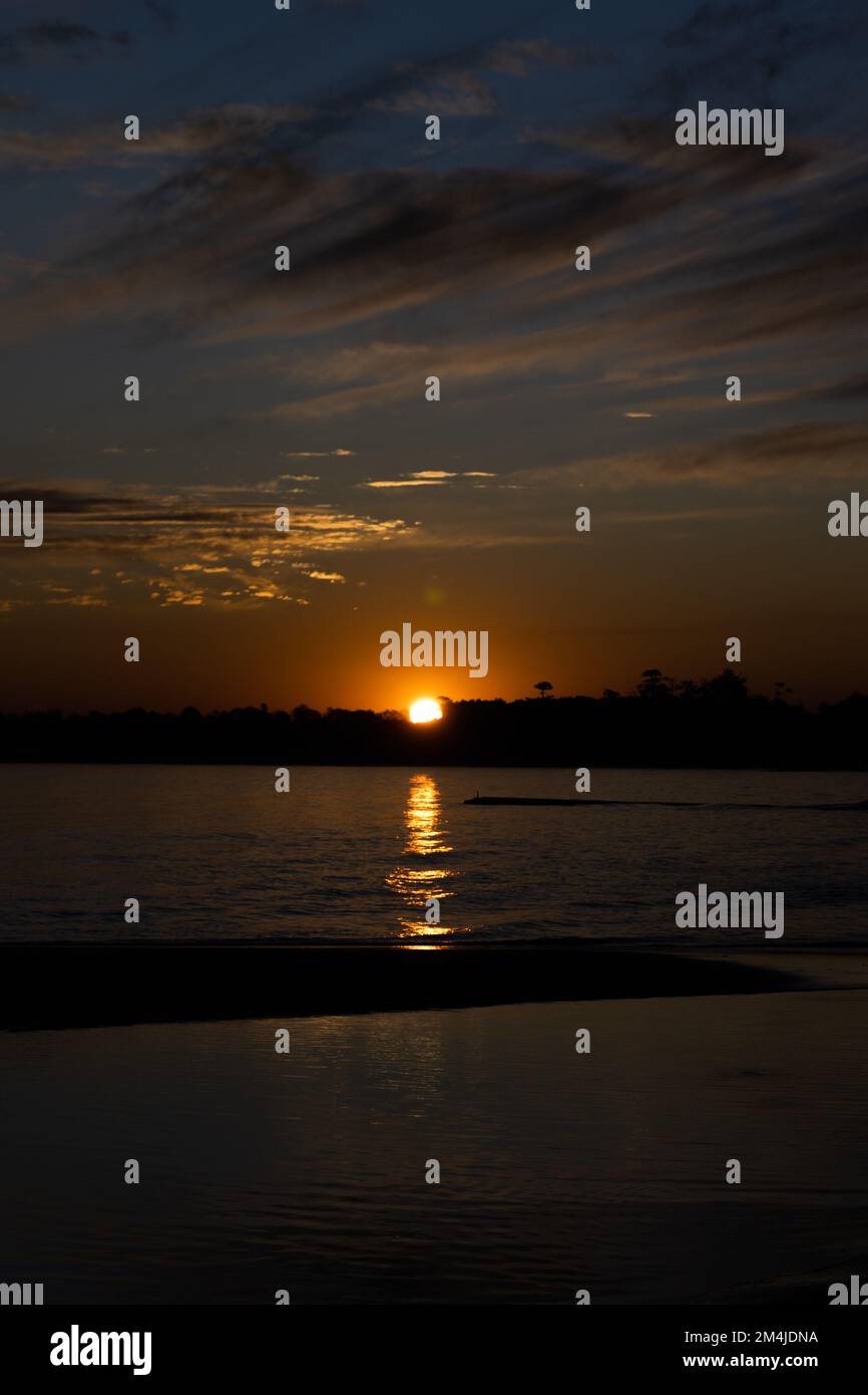 Sunset in the beach. Beautiful sun.Vertical Stock Photo - Alamy