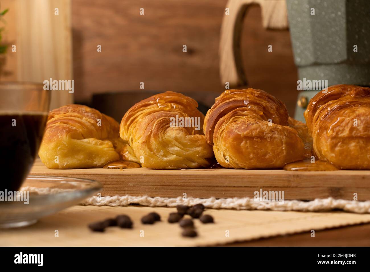 Still life croissants and coffee. coffee beans decorating Stock Photo ...
