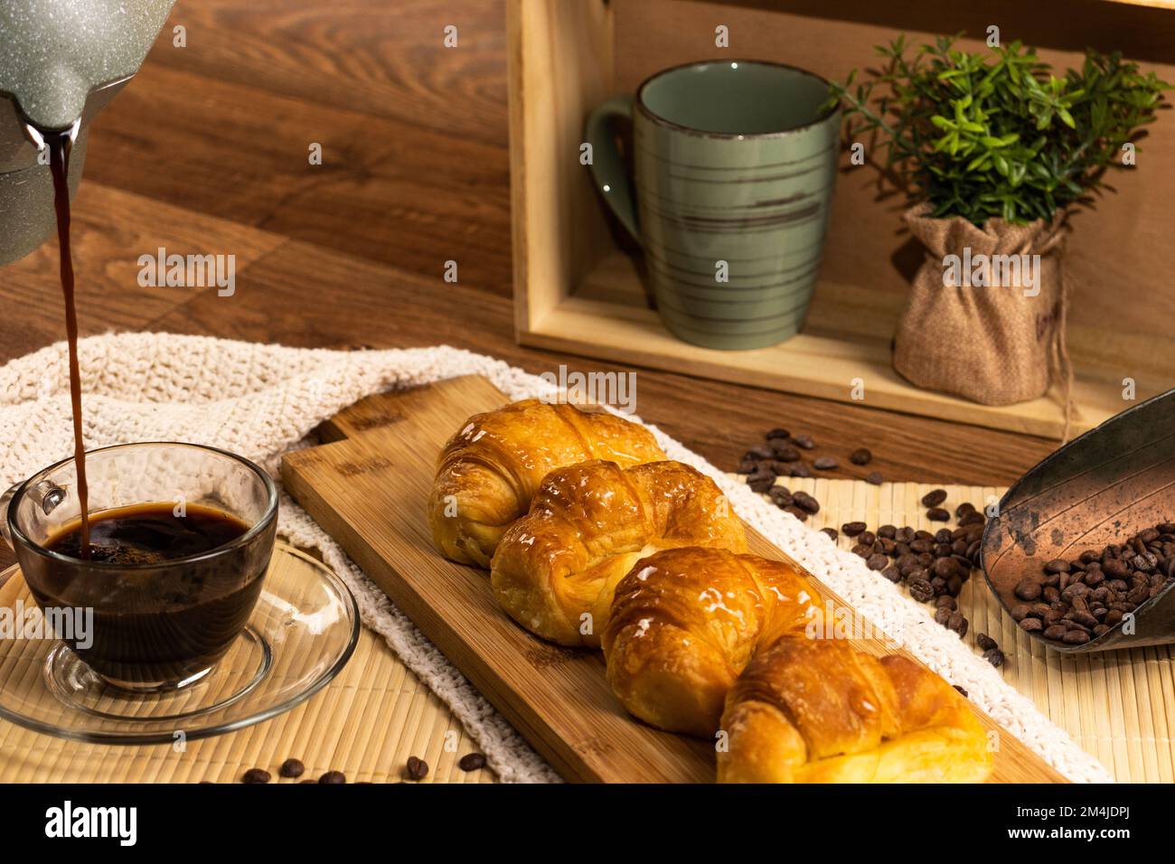 Still life croissants and coffee. coffee beans decorating Stock Photo ...