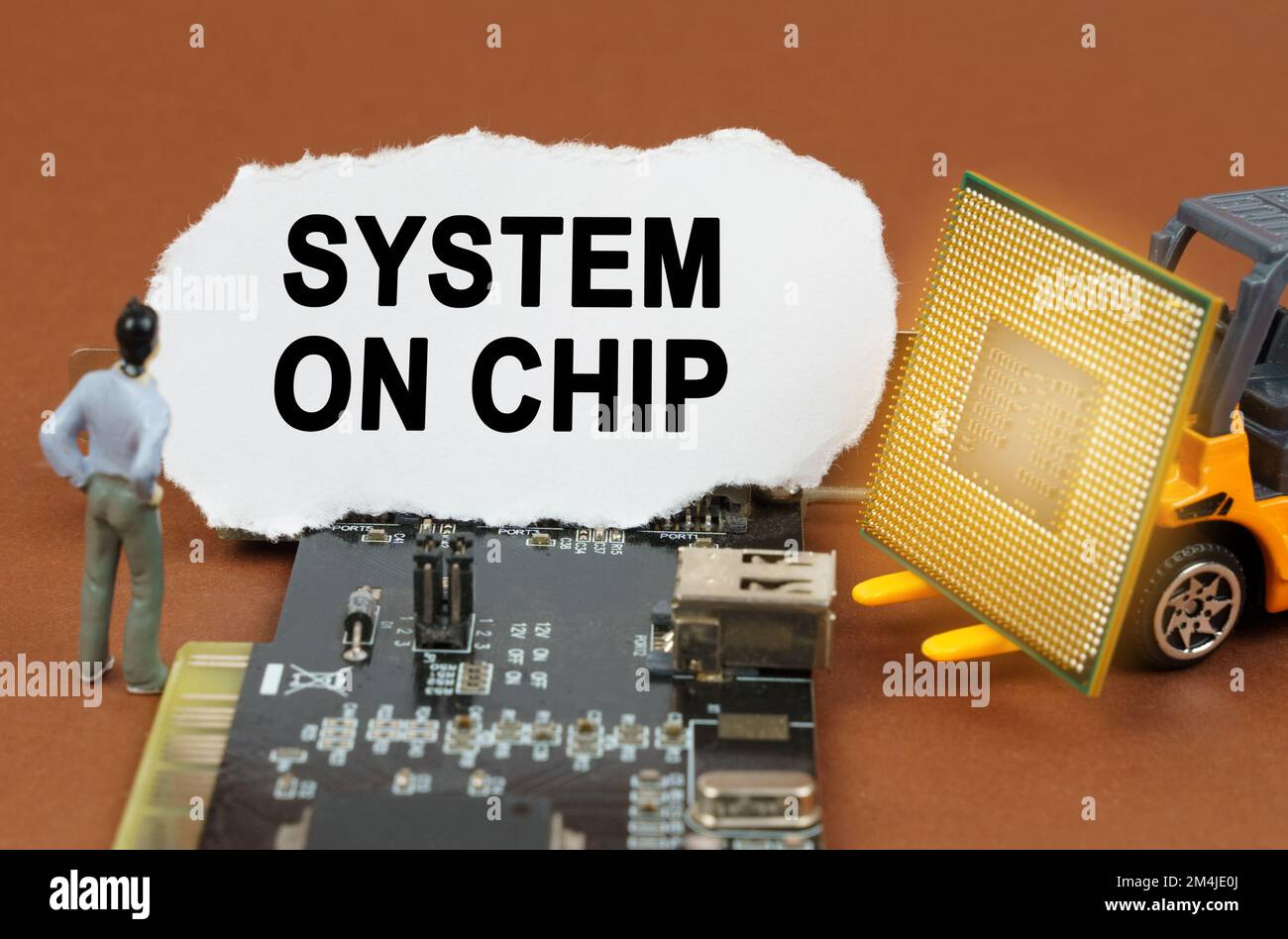 Computer concept. On the board with microcircuits lies a paper plate ...