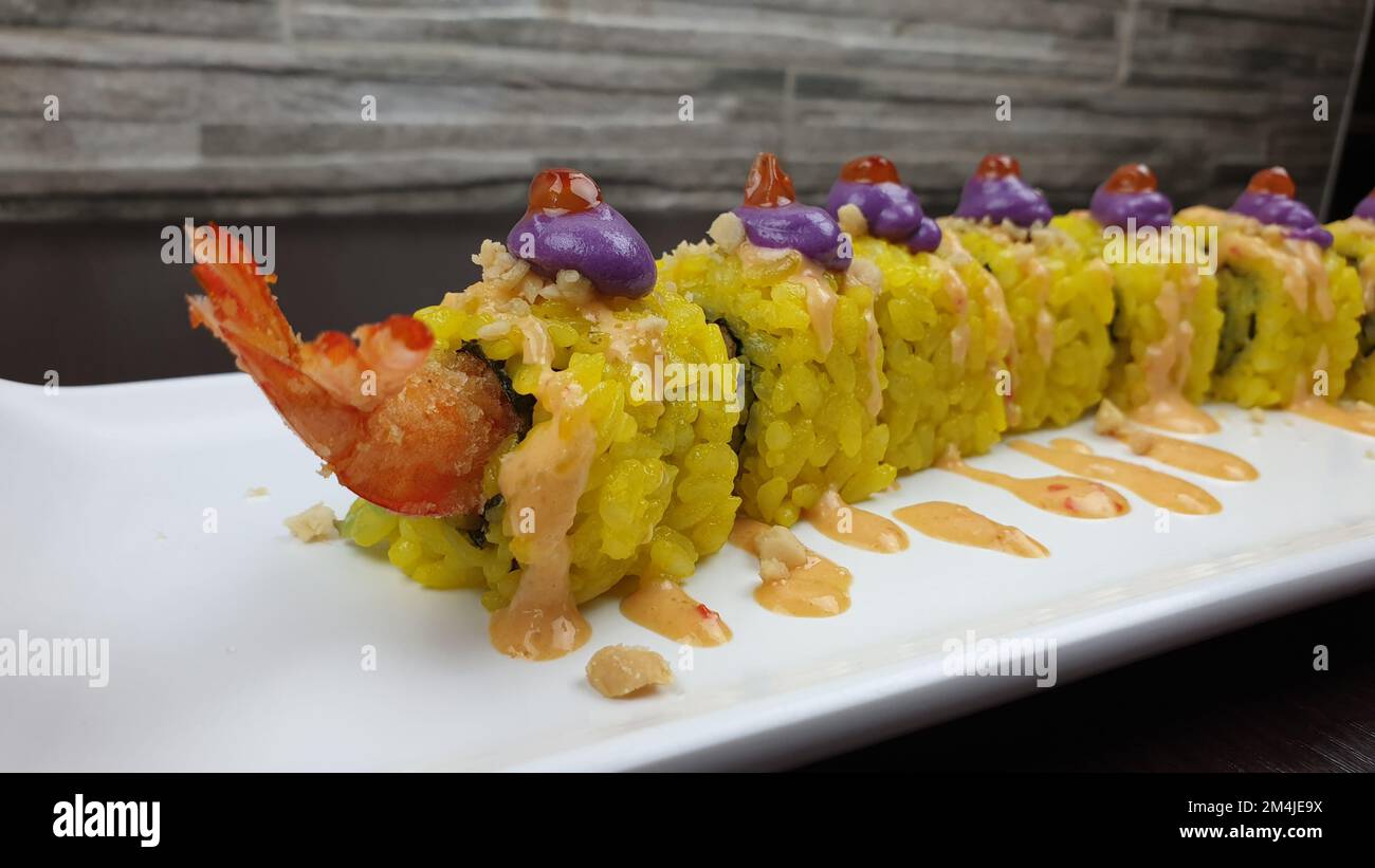 A closeup of a tray of delicious colorful sushi at a Japanese ...