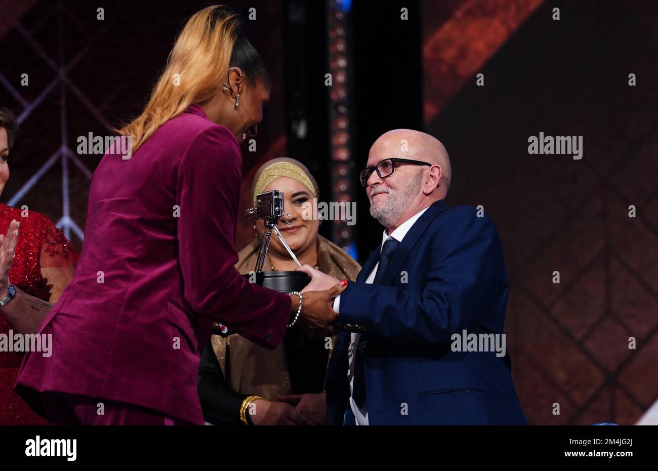 Mike Alden recieves The Unsung Hero Award from Denise Lewis during the ...