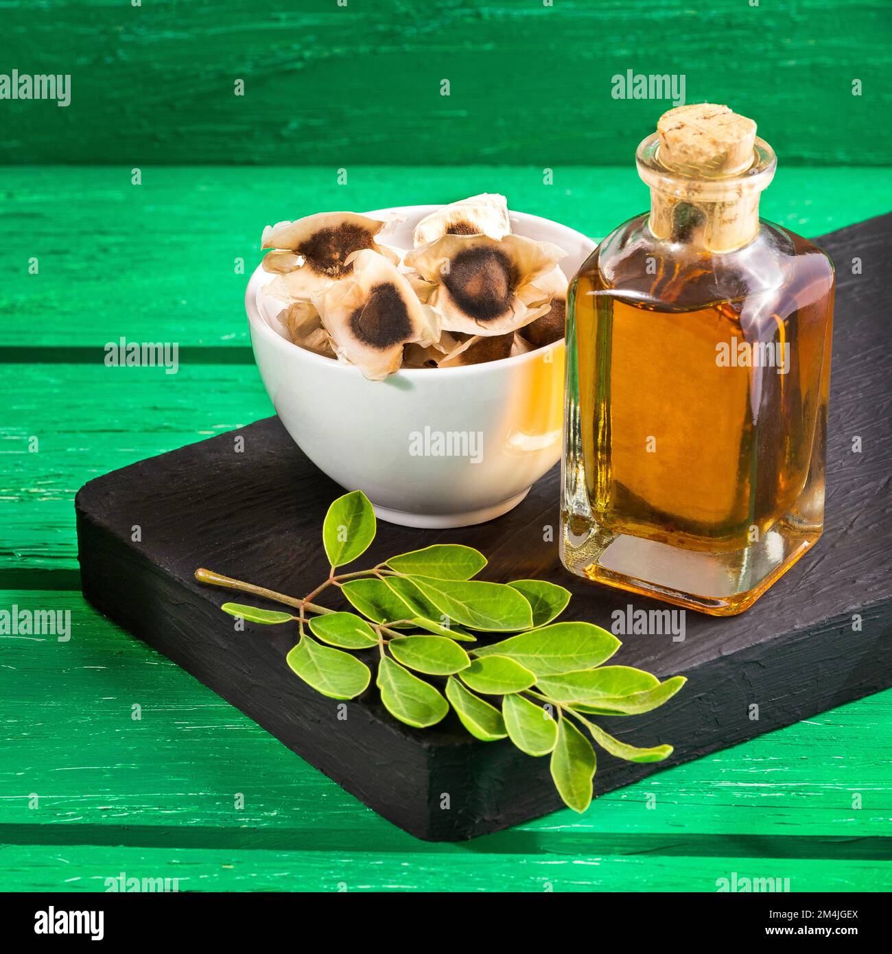 Moringa oleifera - Moringa oil, leaves and seeds Stock Photo - Alamy