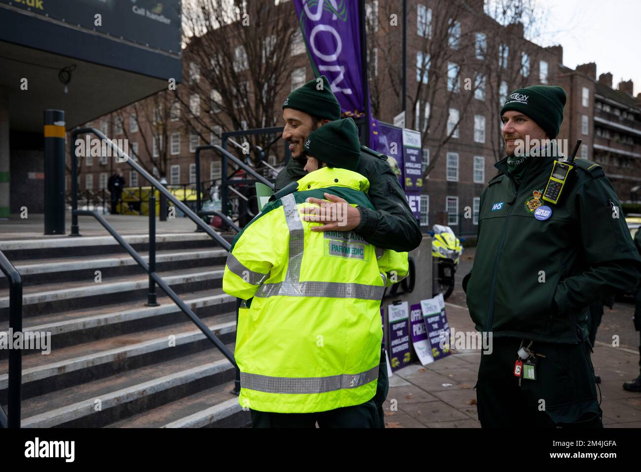 Ambulance workers from the London Ambulance Services are seen hugging ...