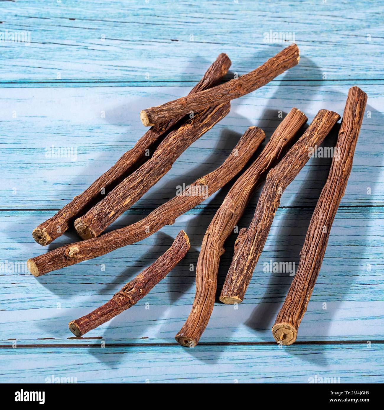 Glycyrrhiza glabra - Dried medicinal licorice sticks Stock Photo - Alamy