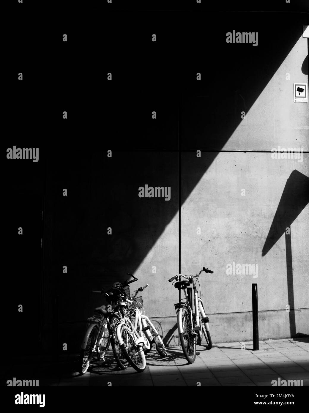 Bicycles parked building Black and White Stock Photos & Images - Alamy
