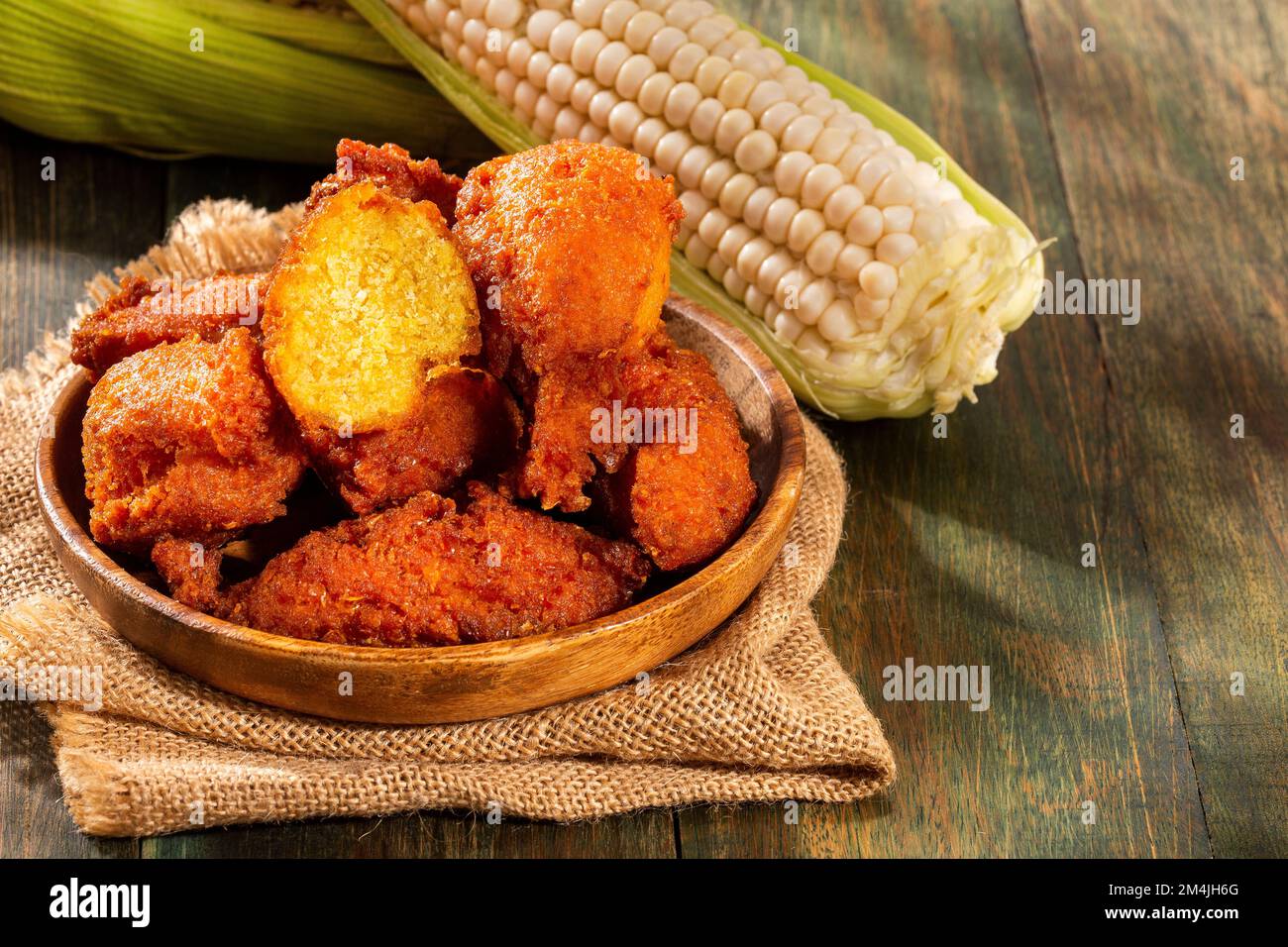 Fried tender corn croquettes - Colombian traditional food Stock Photo ...