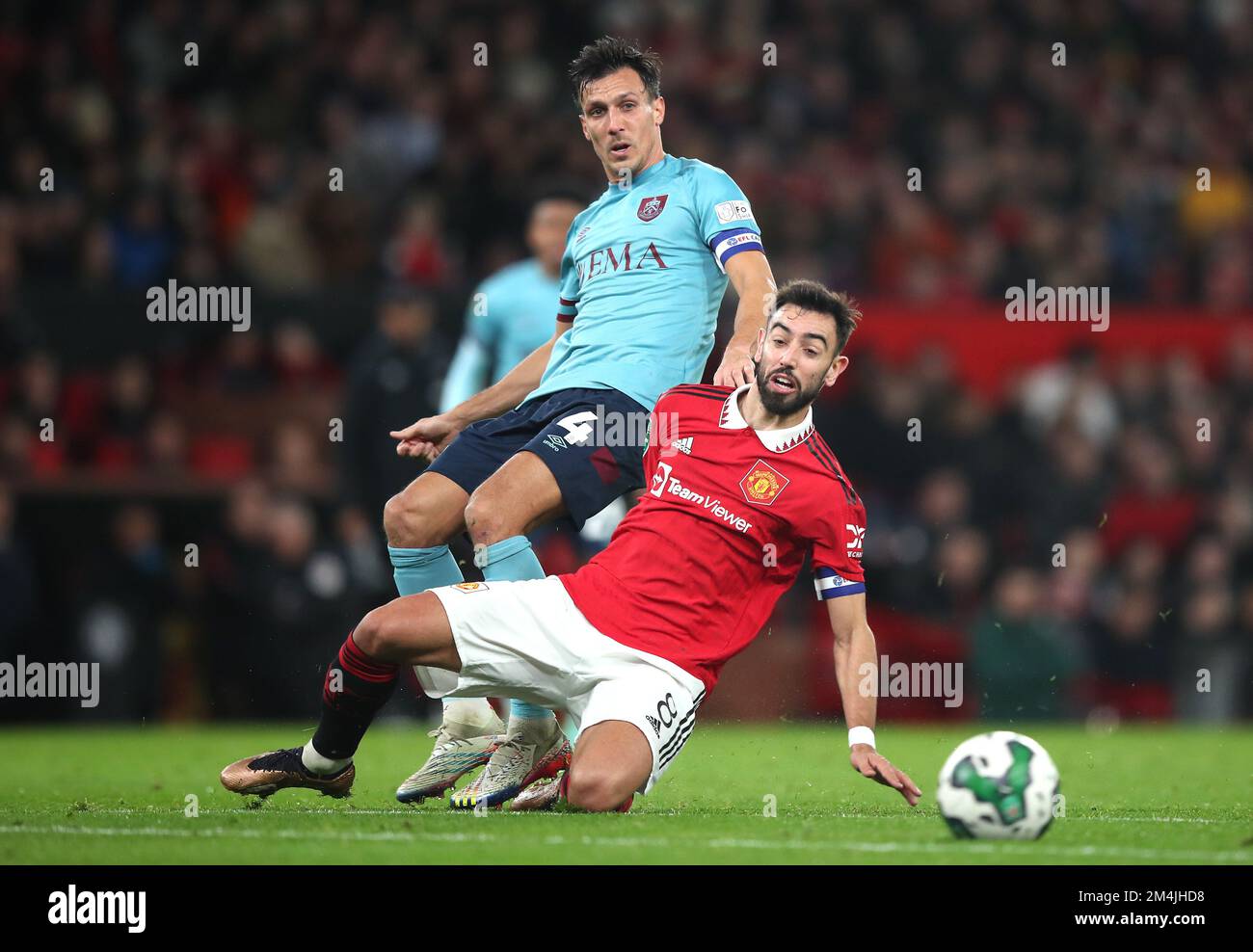 Burnley's Jack Cork (left) makes a tackle on Manchester United's Bruno ...