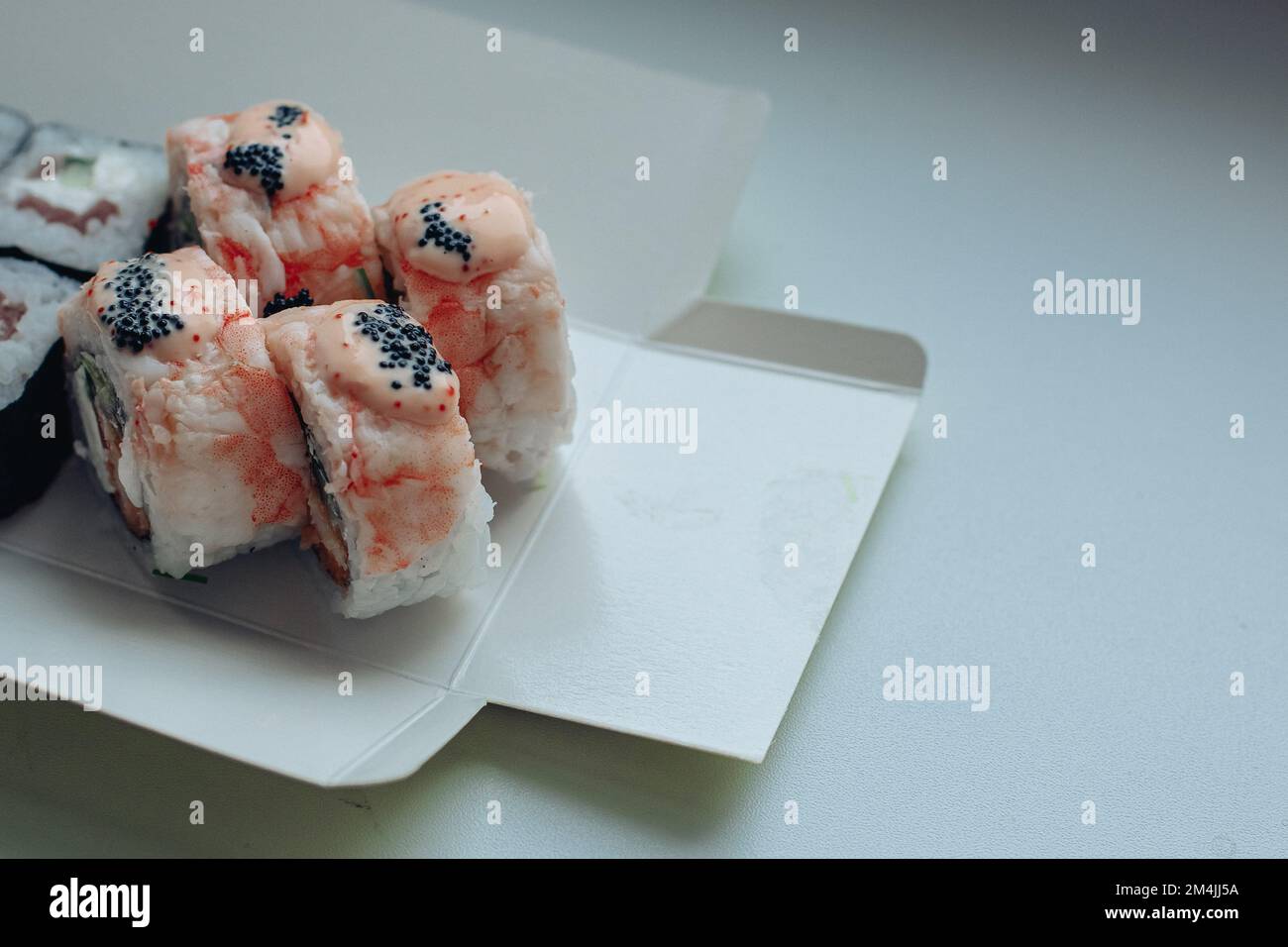 Beautiful delicious sushi. Sushi delivery. Advertising sushi rolls made ...