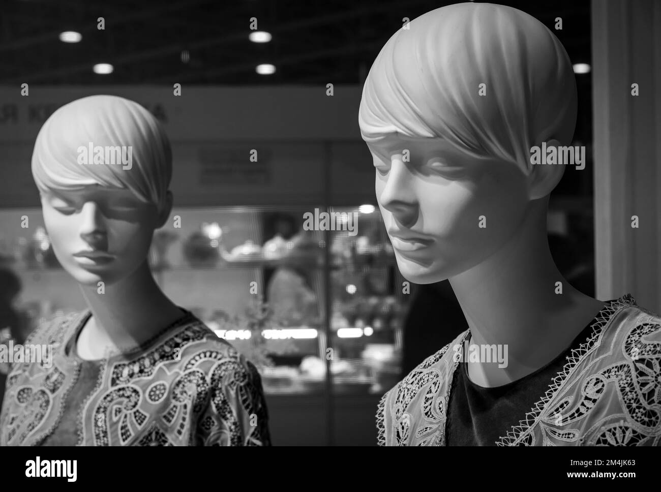 Female mannequins in lace dresses. Black and white photo of mannequins ...