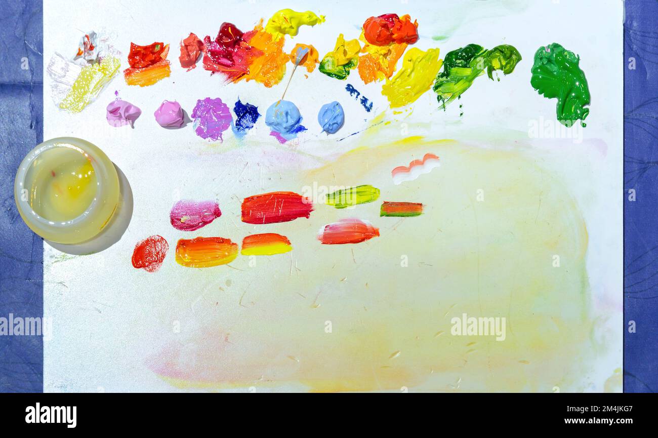 Artistic palette with multi-colored paints on white background Stock ...