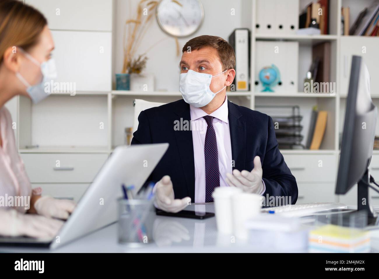 Use of personal protective equipment by office workers Stock Photo - Alamy