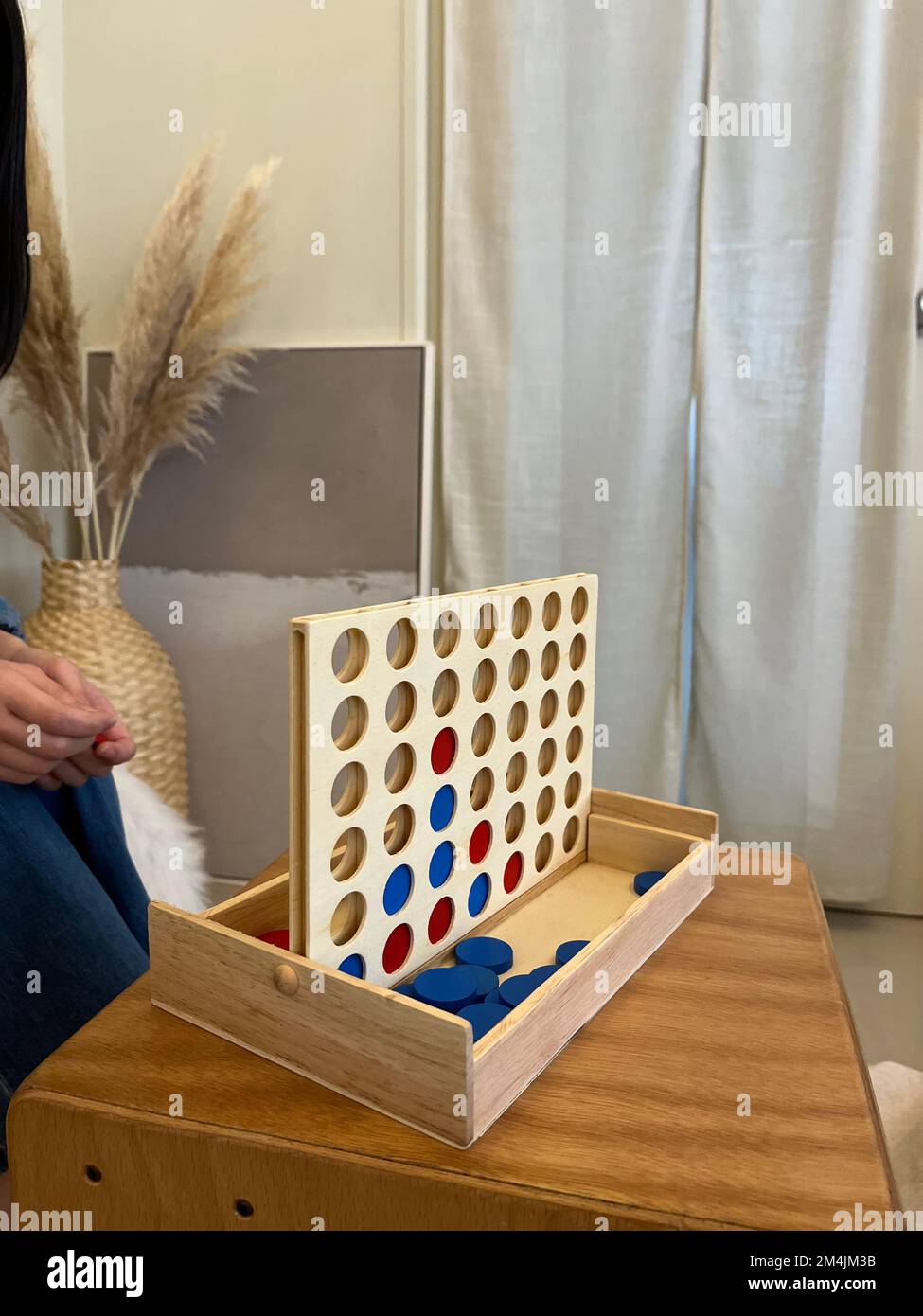 A board game with blue and red circular checkers in a wooden box Stock ...