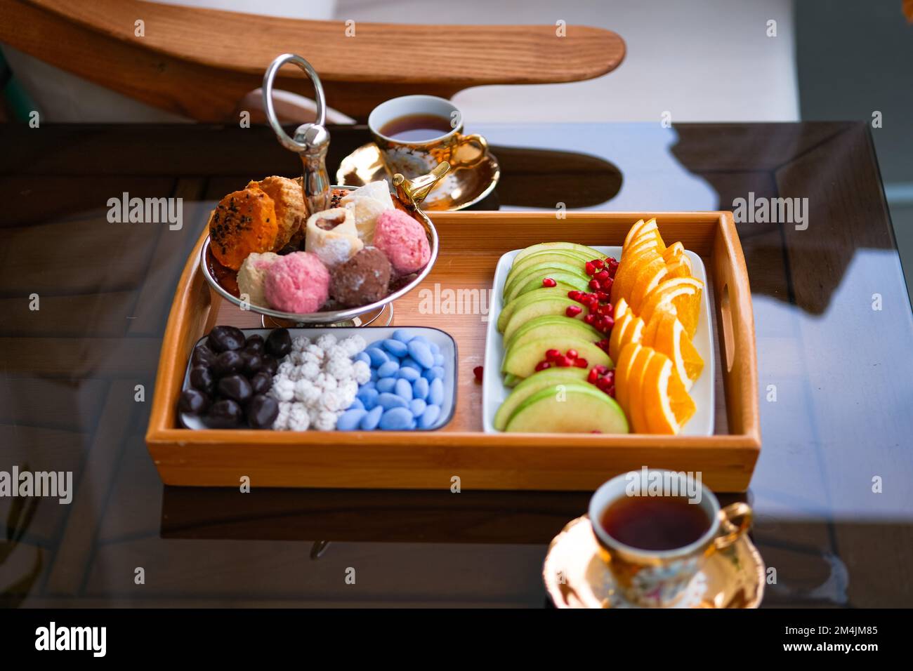 Tray of sweets and fruit served for tea Stock Photo - Alamy