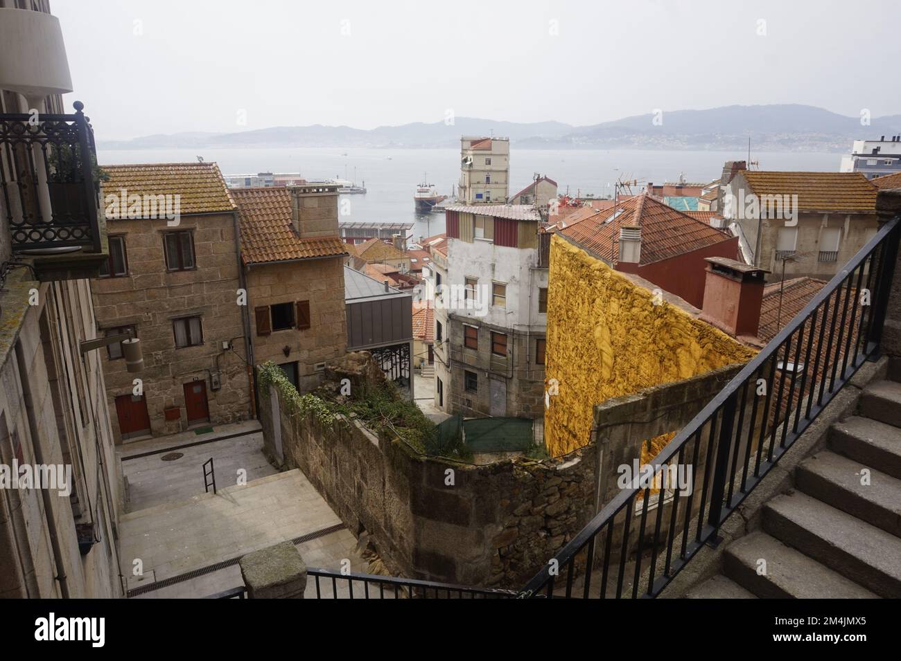 A scenic view of the city of Vigo in Spain with old residential houses ...