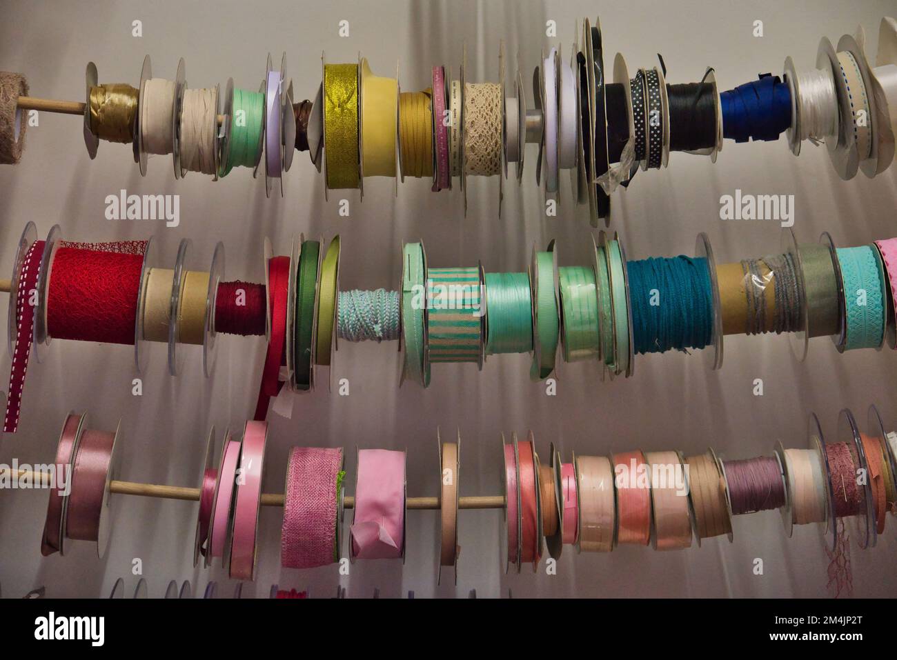 Photograph a ribbon workstation on a small local workshop for handmade ...