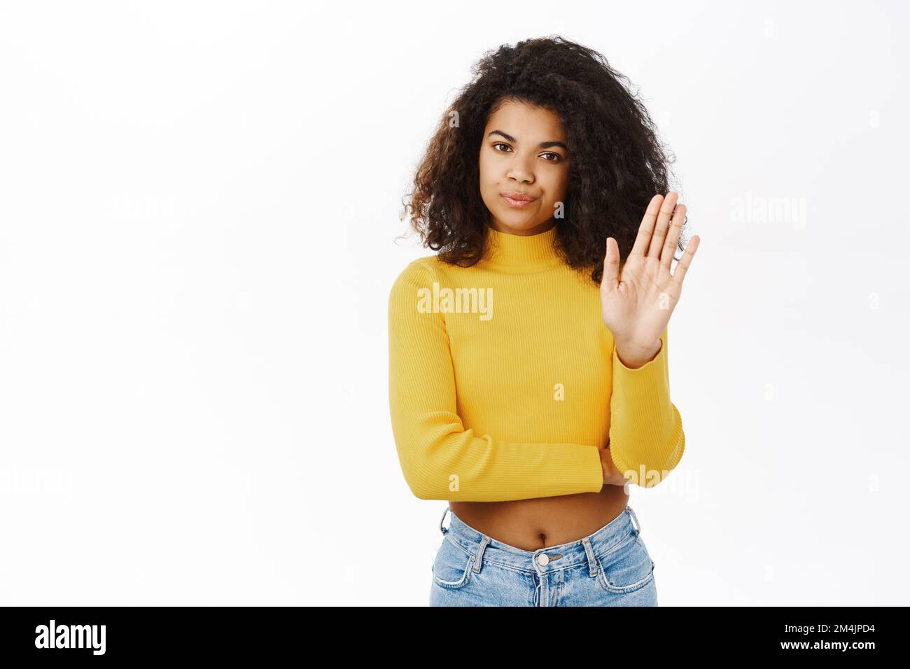 Portrait of african american girl showing stop hands, taboo, block ...
