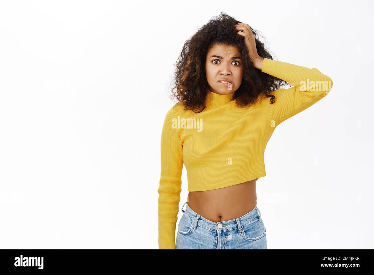 Scared and worried young Black woman, looks concerned, made a mistake ... Scared and worried young Black woman, looks concerned, made a mistake ...
