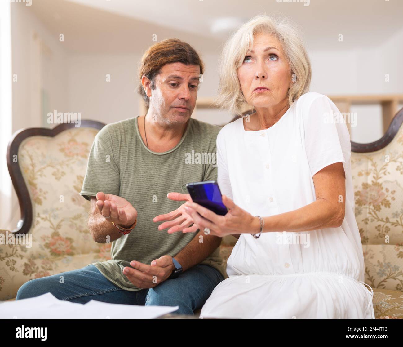 Man 60 woman phone talk hi-res stock photography and images - Alamy