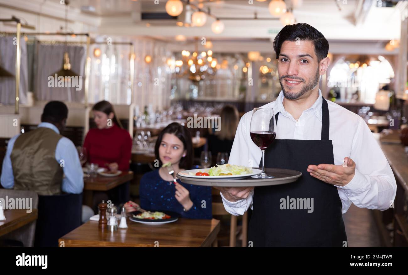 Waiter holding tray drinks hi-res stock photography and images - Alamy