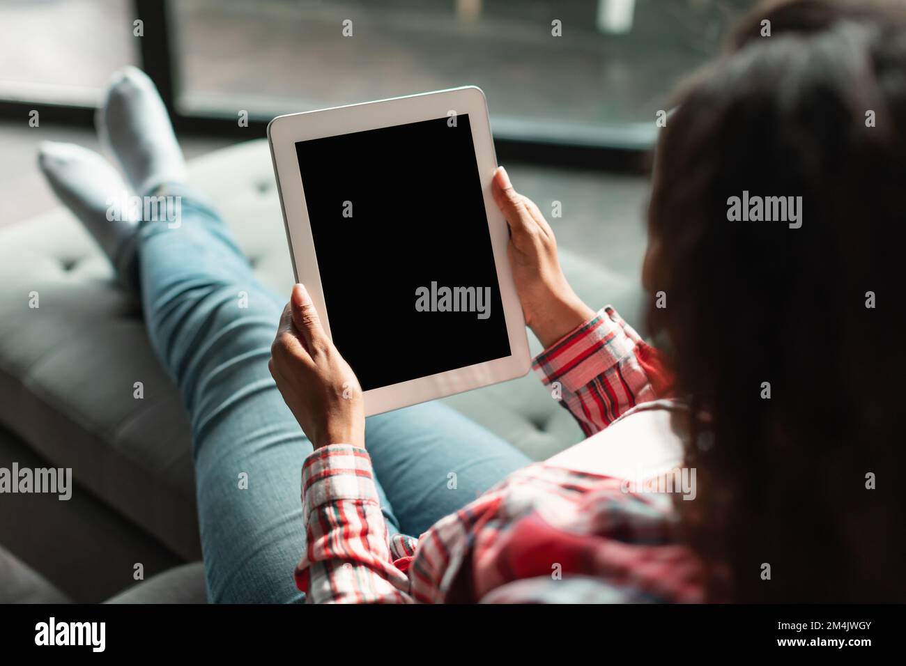New app for chat. Millennial black female using tablet with blank ...