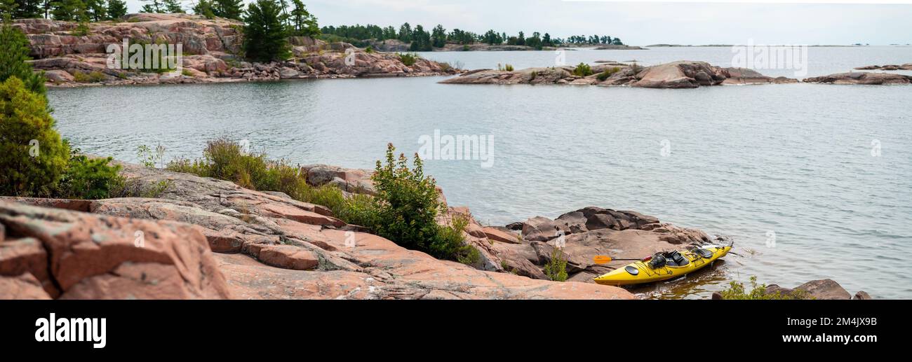 Kayaks on the smooth granite rocks of Georgian Bay Ontario Stock Photo ...