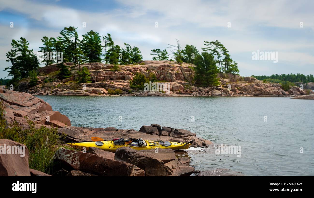 Kayaks on the smooth granite rocks of Georgian Bay Ontario Stock Photo ...