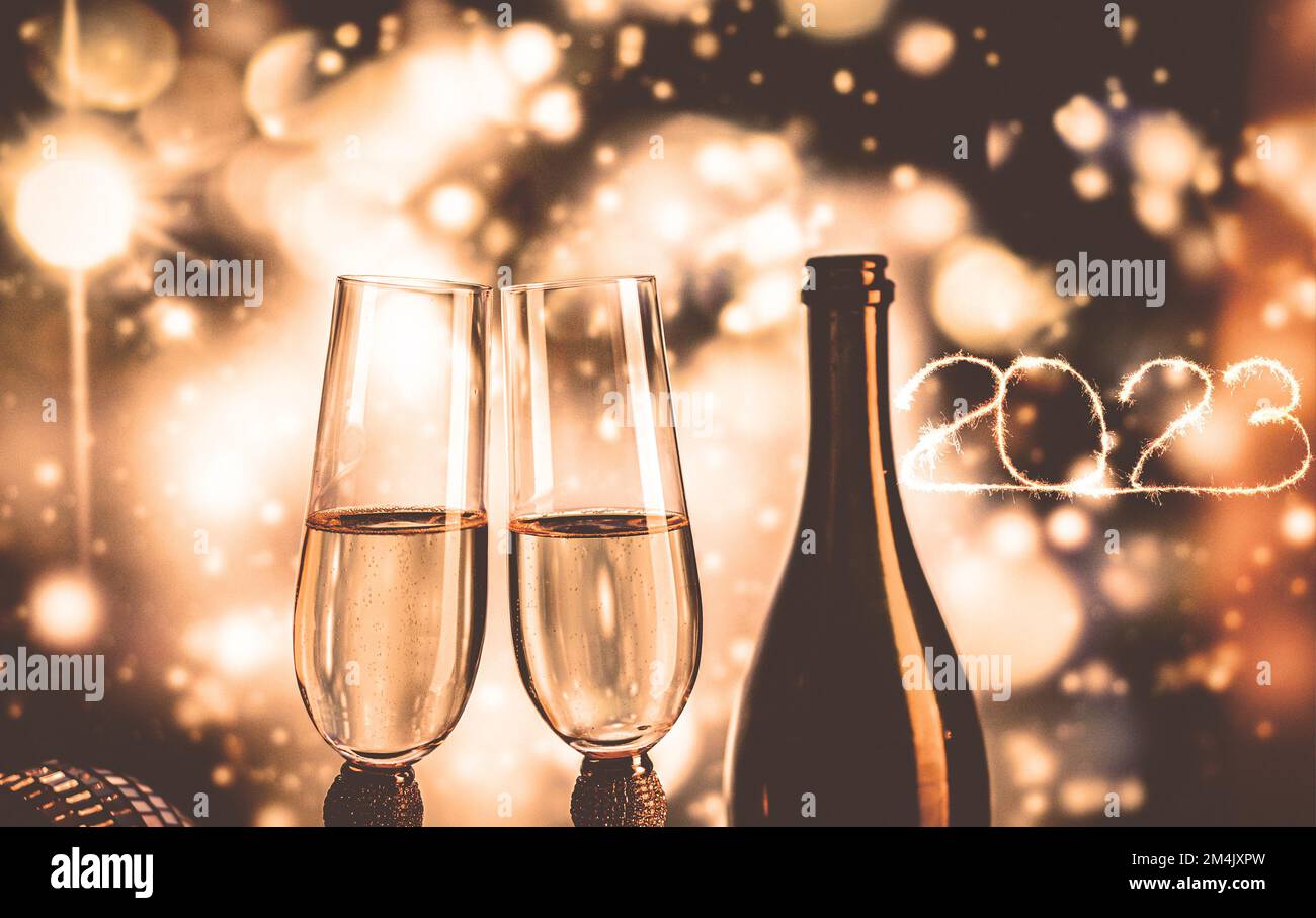 happy New Year champagne glasses and fireworks celebration background ...