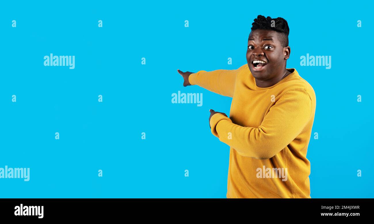 Look There. Amazed Black Man Pointing At Copy Space Behind Him Stock ...