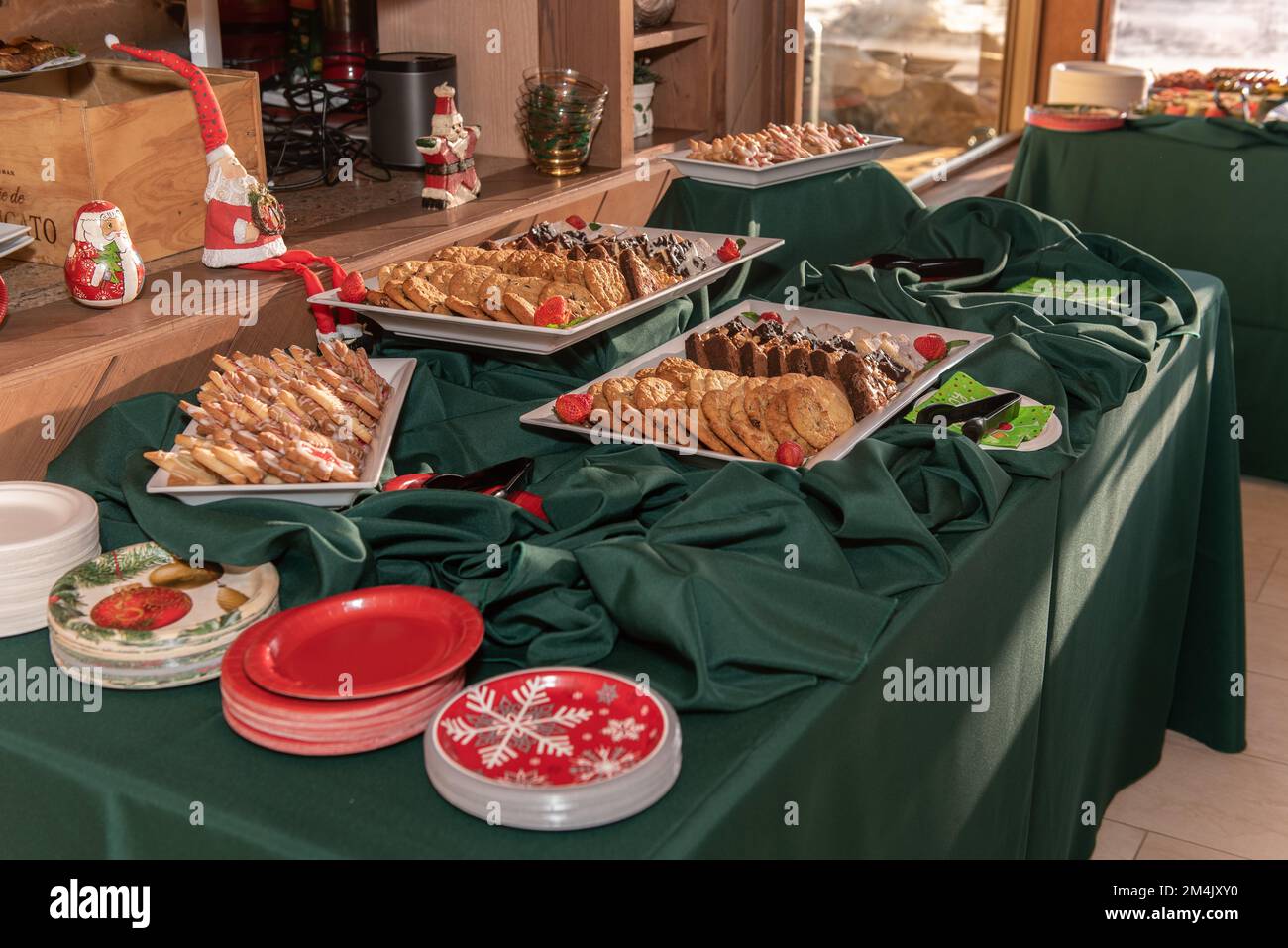 Buffet table full of different kinds of cookies and snacks for the ...