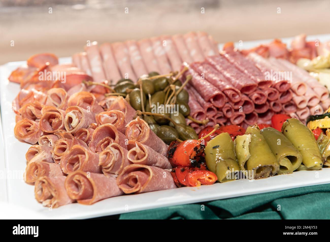 Buffet table full of different kinds of appetizers along with rolled ...