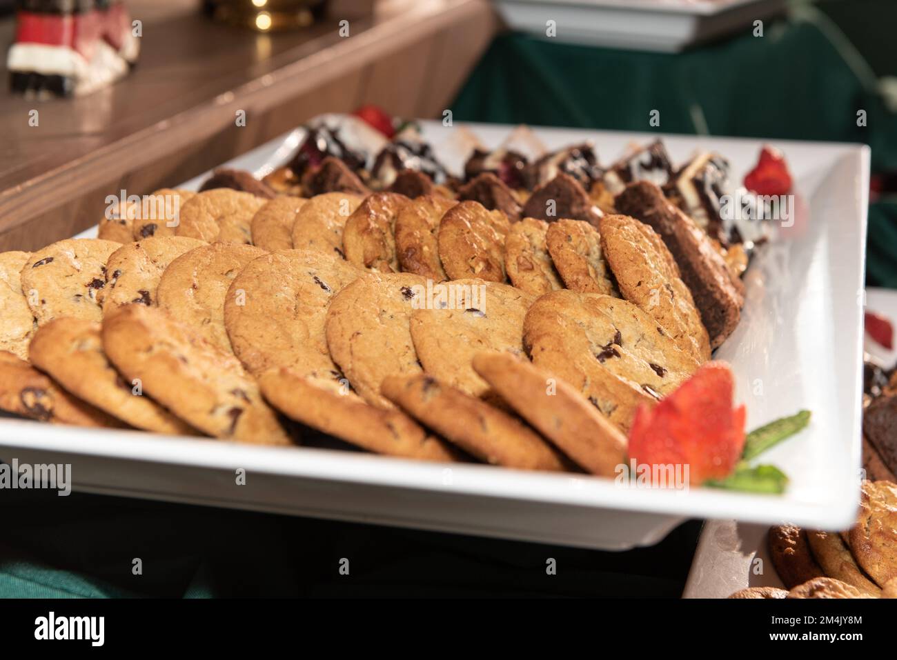 Buffet table full of different kinds of treats with chocolate chip ...