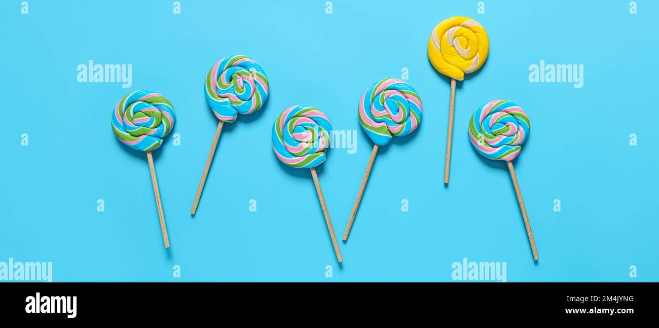 Tasty lollipops on light blue background. Concept of uniqueness Stock ...
