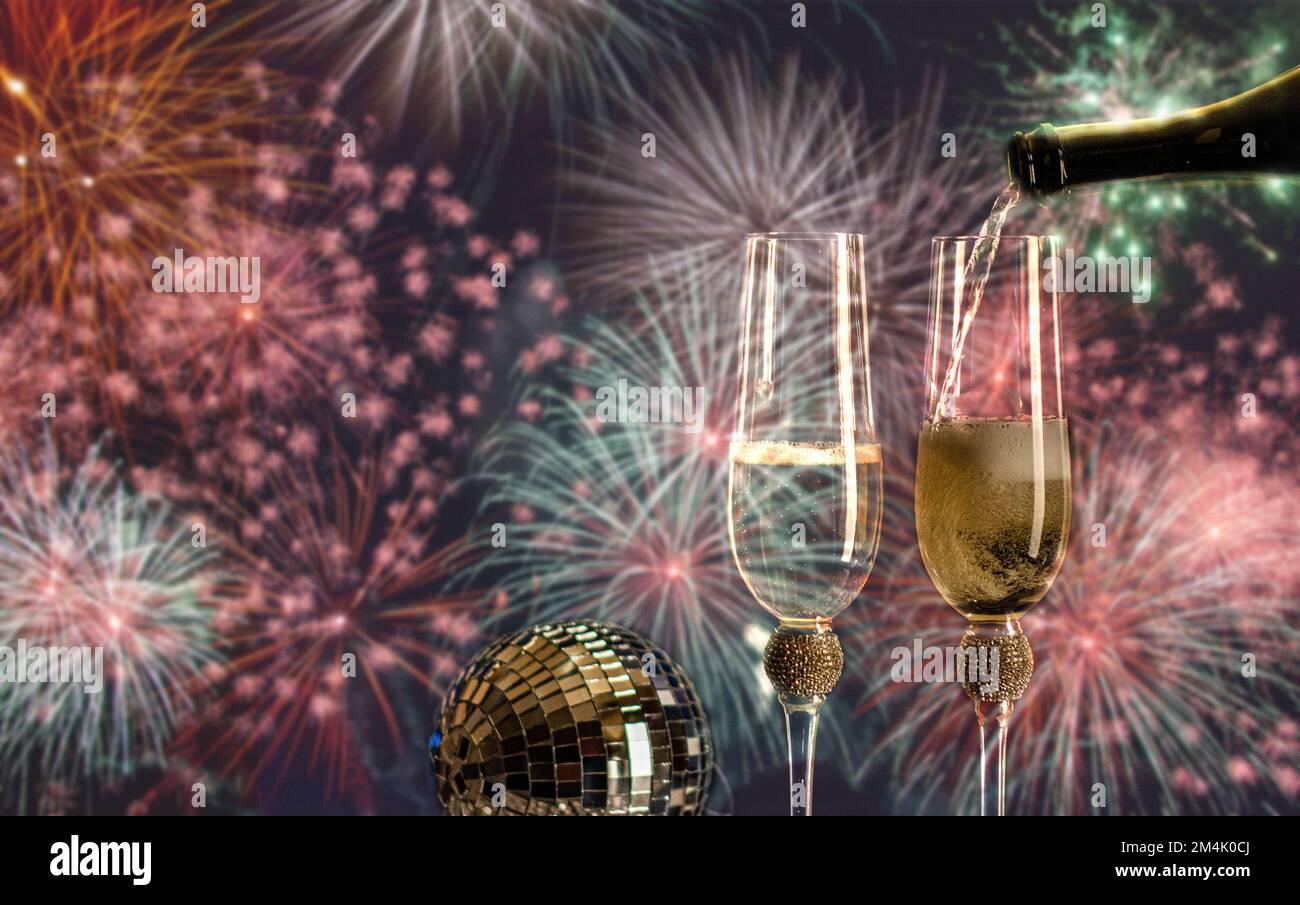 happy New Year champagne glasses and fireworks celebration background ...