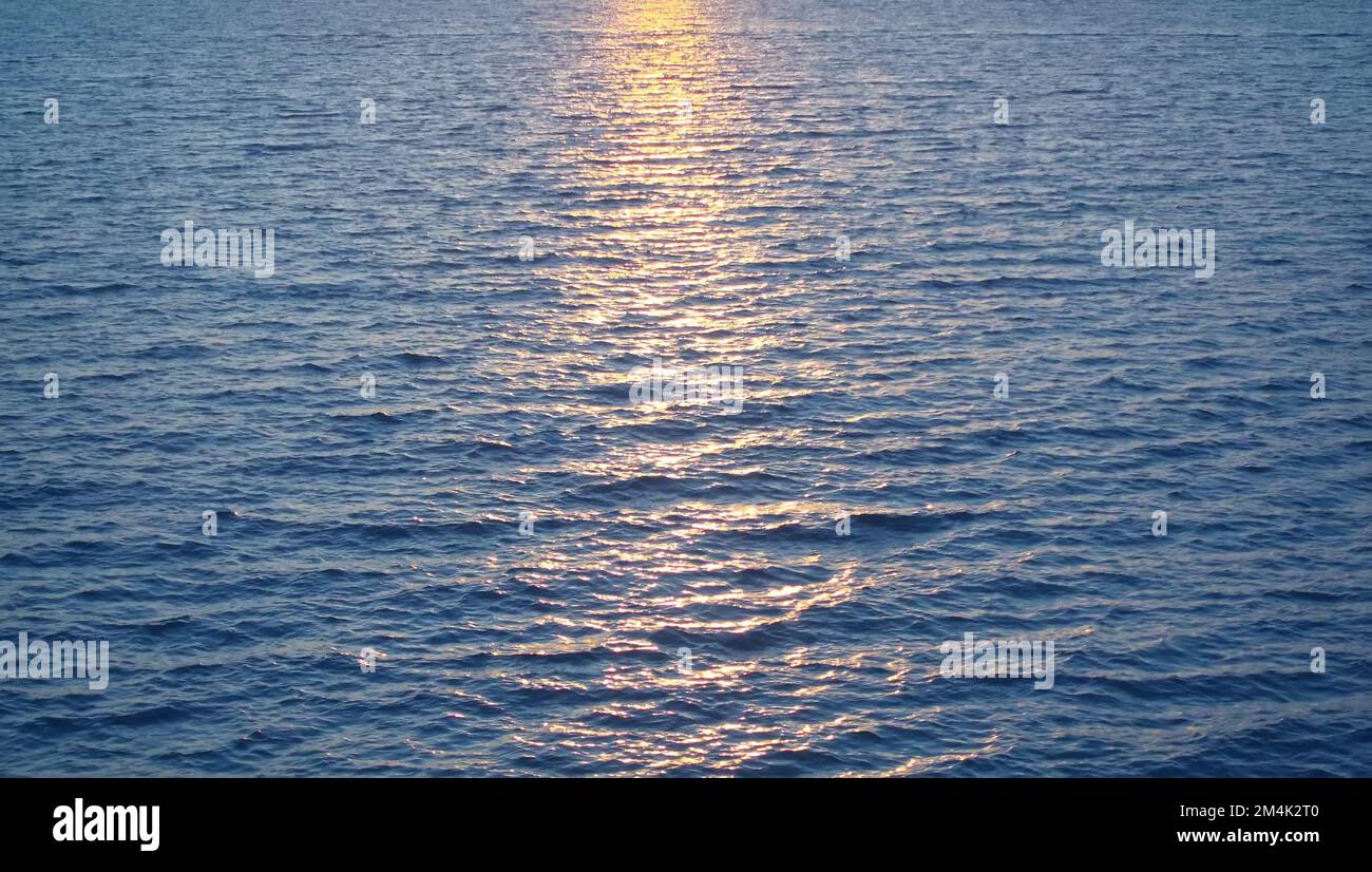 Beautiful water surface in sunlight over horizon Stock Photo - Alamy
