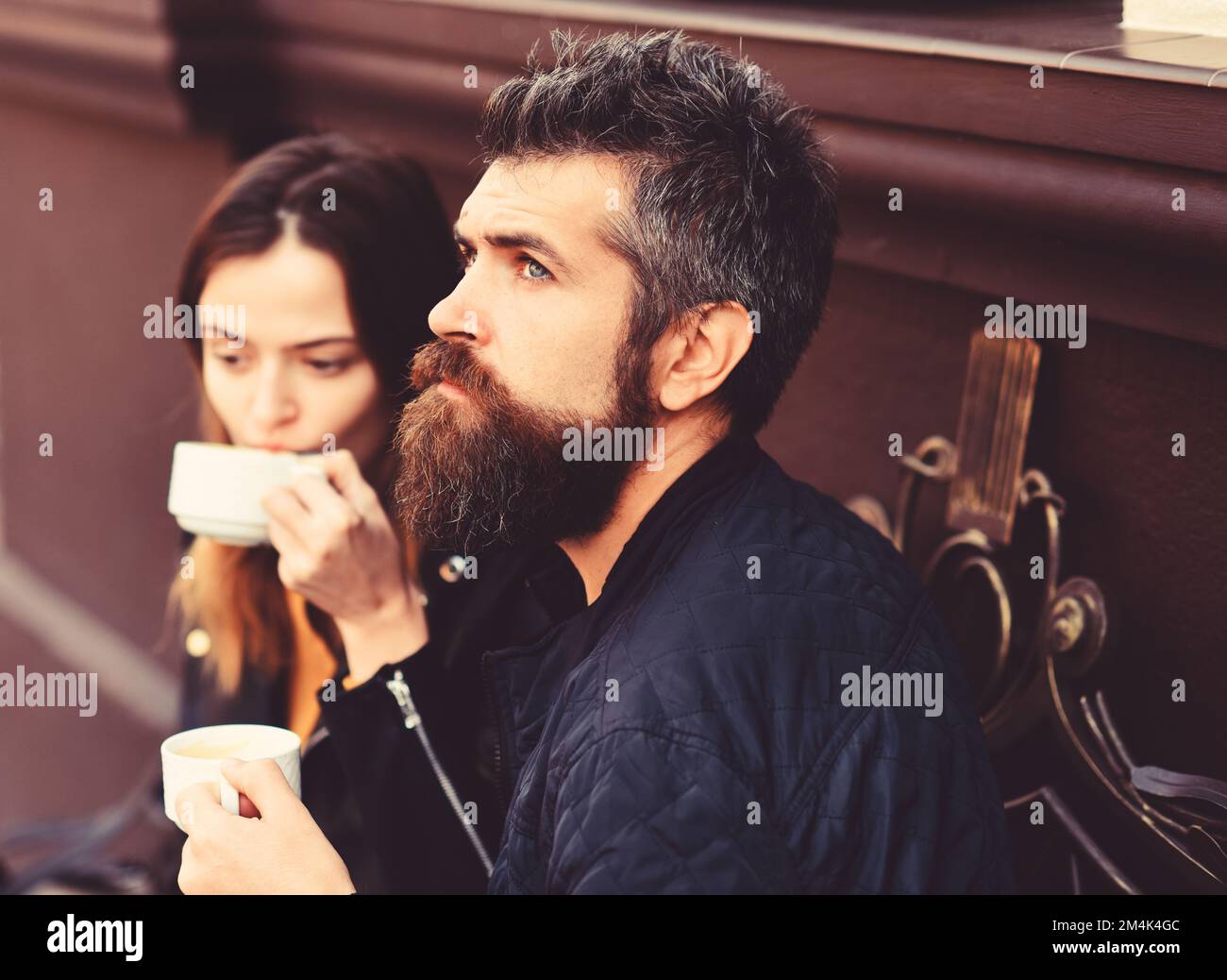 Woman and man with thoughtful faces have date at cafe Stock Photo - Alamy