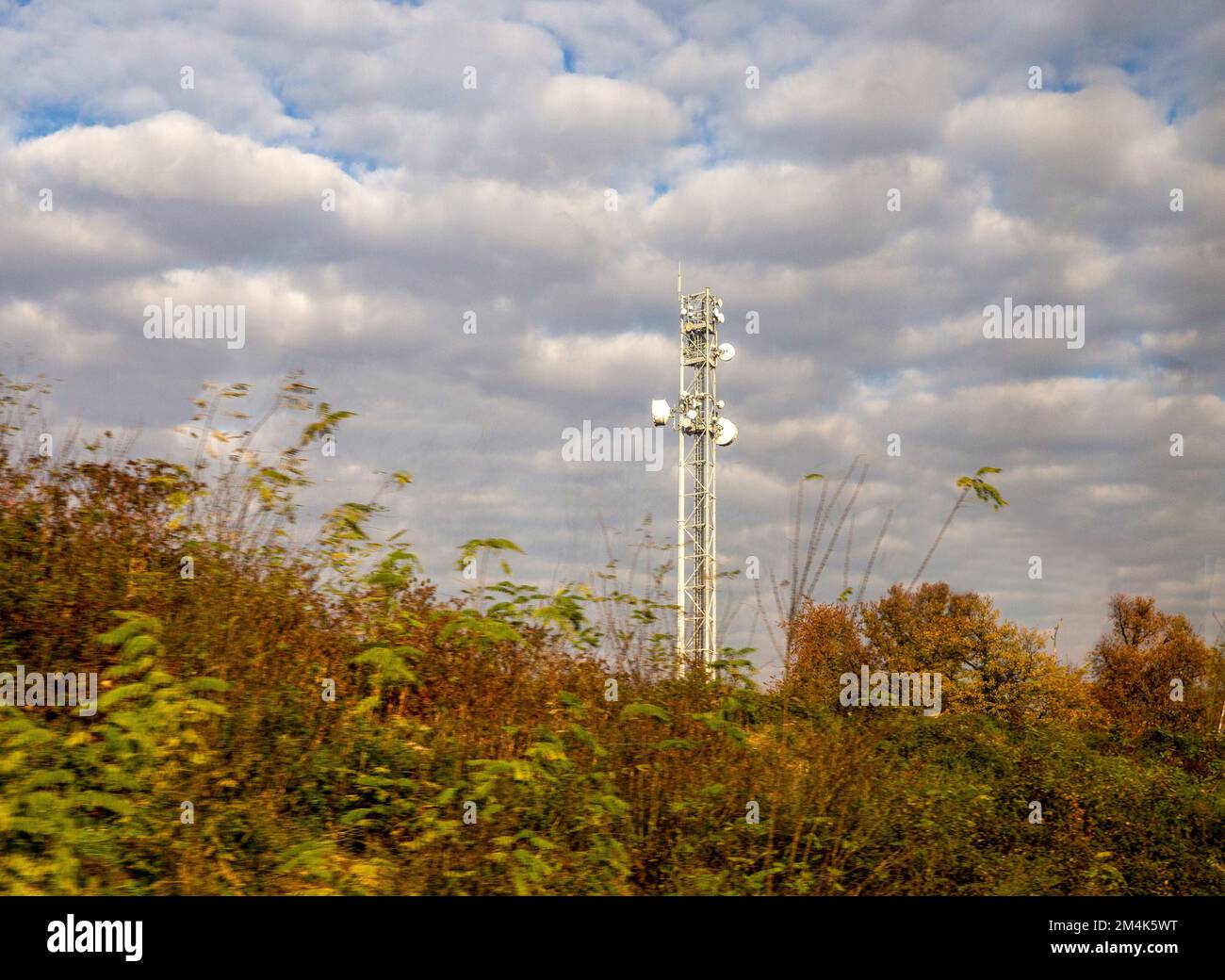 Cellular relay tower in northern Italy. Photo through the window Stock ...