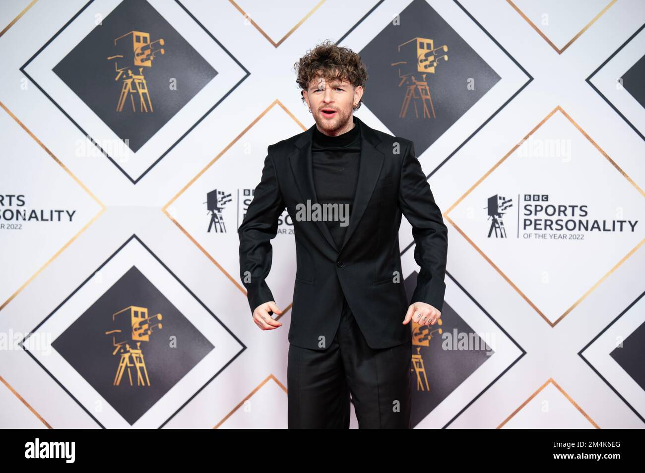 Manchester, UK. 21st December 2022. Tom Grennan arrives on the red ... Manchester, UK. 21st December 2022. Tom Grennan arrives on the red ...