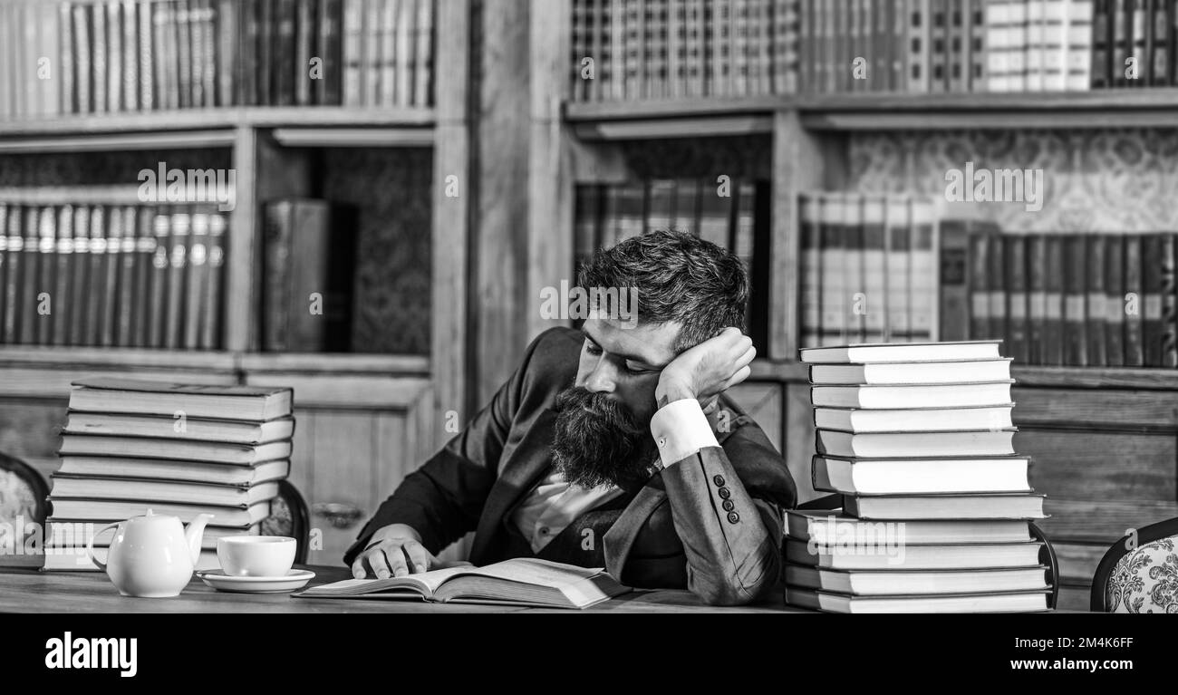 Man sitting table book Black and White Stock Photos & Images - Alamy