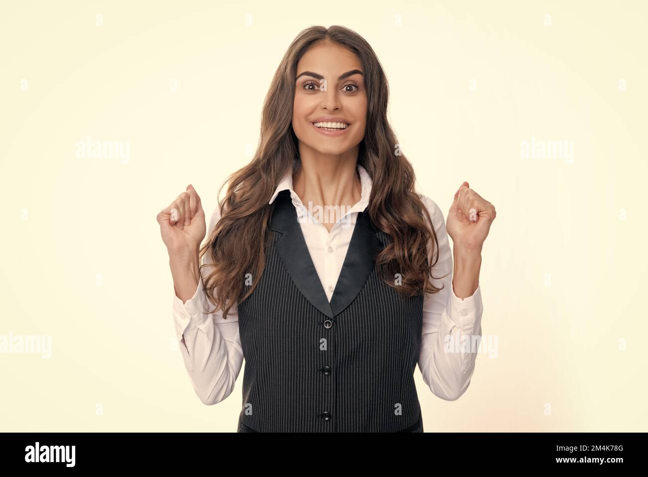 Cheerful beautiful young woman showing winner gesture. Girl celebrating ...