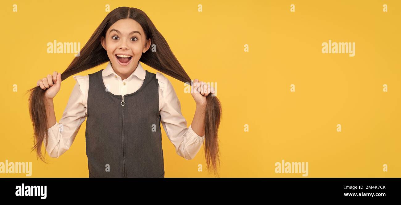 Tangle free haircare. Surprised kid hold long hair. Child face ...