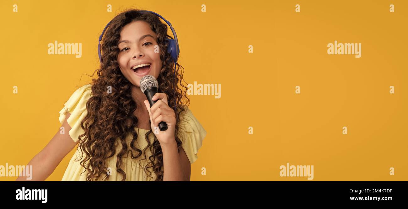 child singer sing karaoke in microphone. online vocal education. Child ...