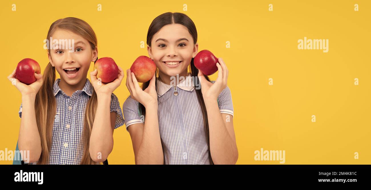 Happy children back to school holding apples for healthy eating ...