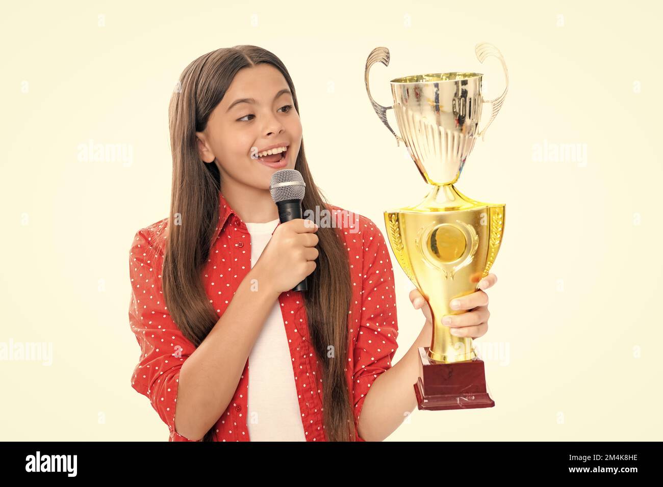 Teenager girl with win cup. Teen holding a trophy microphone speech ...