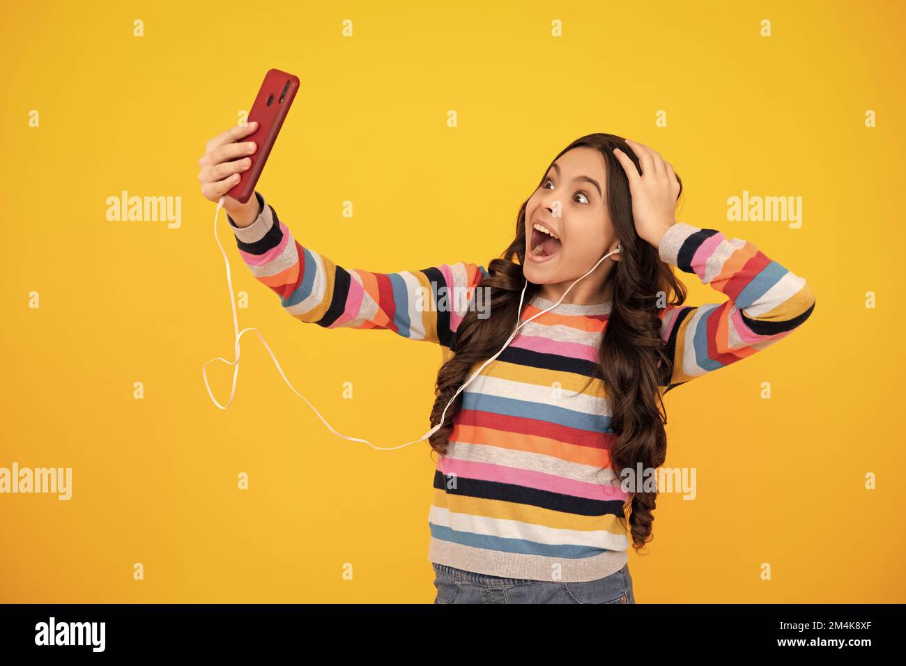 Kids selfie. Portrait of cute teenage girl using mobile phone, chatting ...