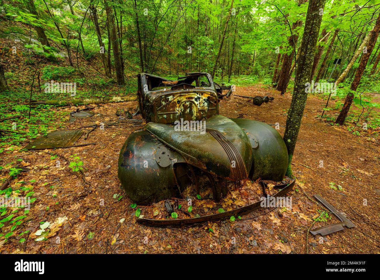 Derelict vehicle in the forest, Killarney Provincial Park, Ontario ...