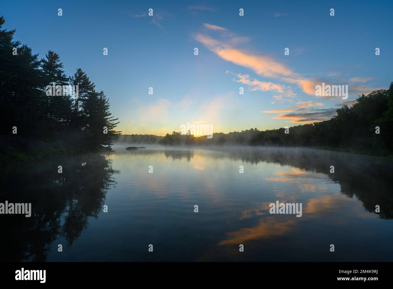 Sunrise reflections at George Lake, Killarney Provincial Park, Ontario ...